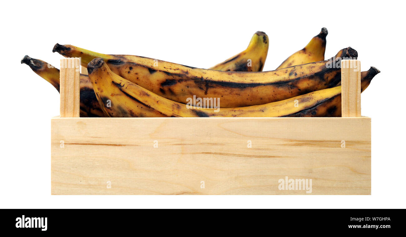 over ripe banana plantain in wooden case on white background Stock ...
