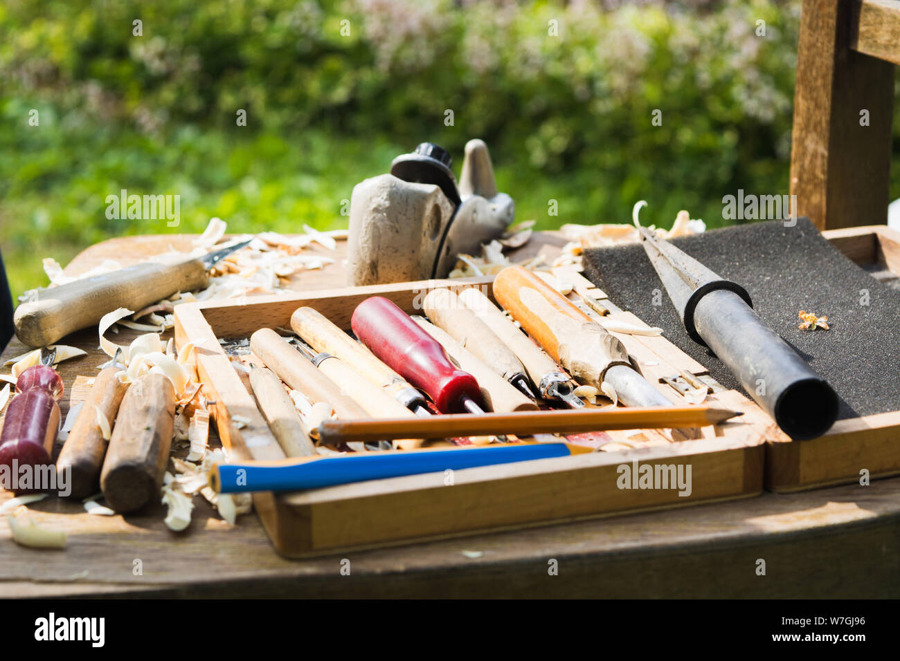 Wood carving tools in wooden box with nature background. Selectiv focus ...