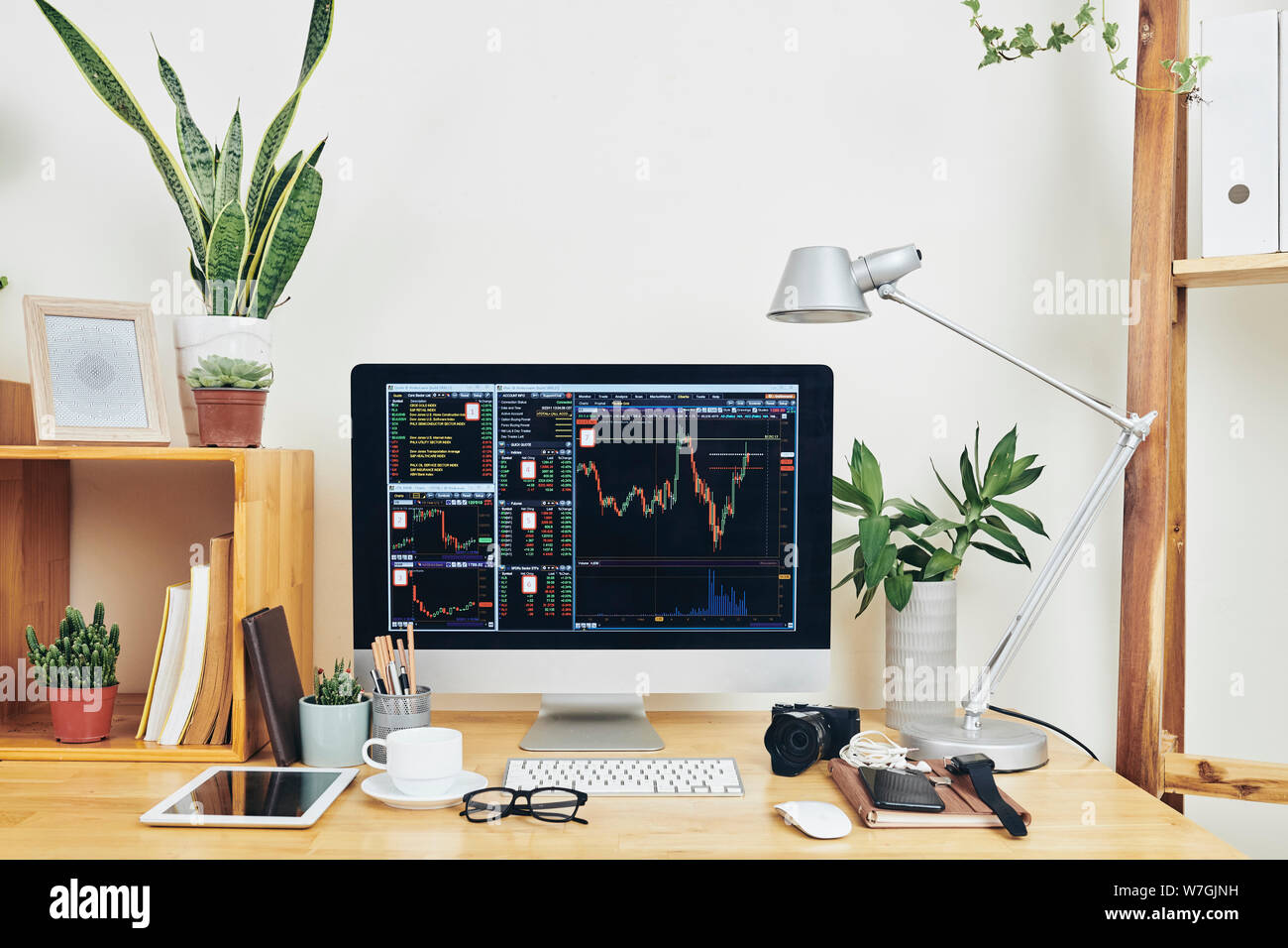 Charts depecting stock market changes on screen of computer on office ...