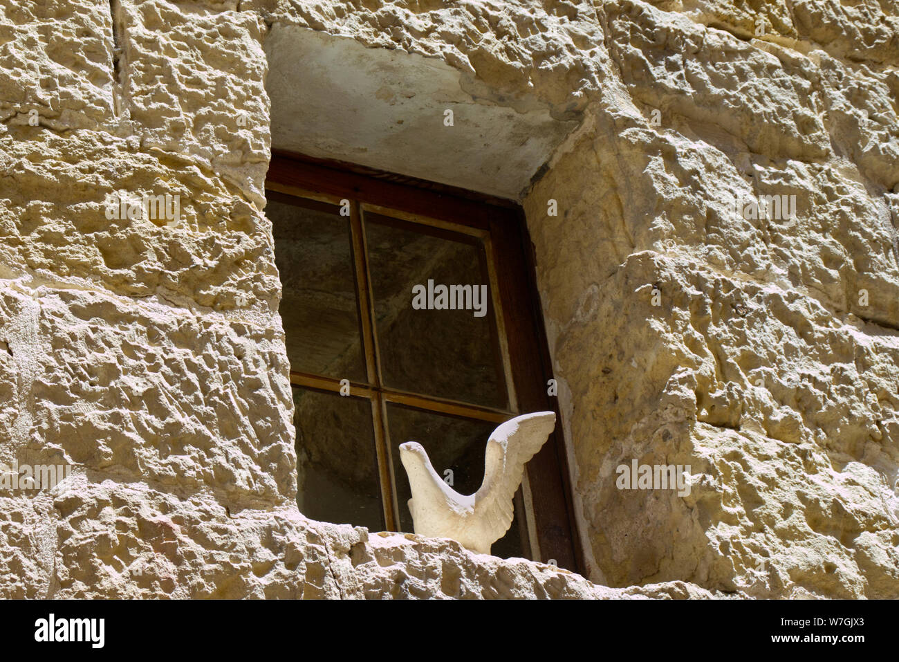 An ornamental stone dove on a windowsill in Gozo Stock Photo - Alamy