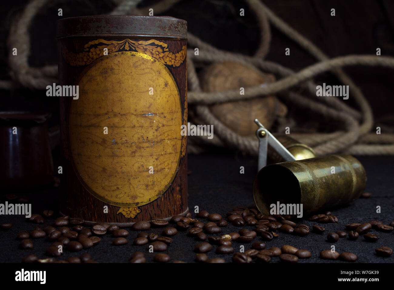 Vintage Rusted Coffee Tin Canister and Grinder With Coffee Beans On a ...
