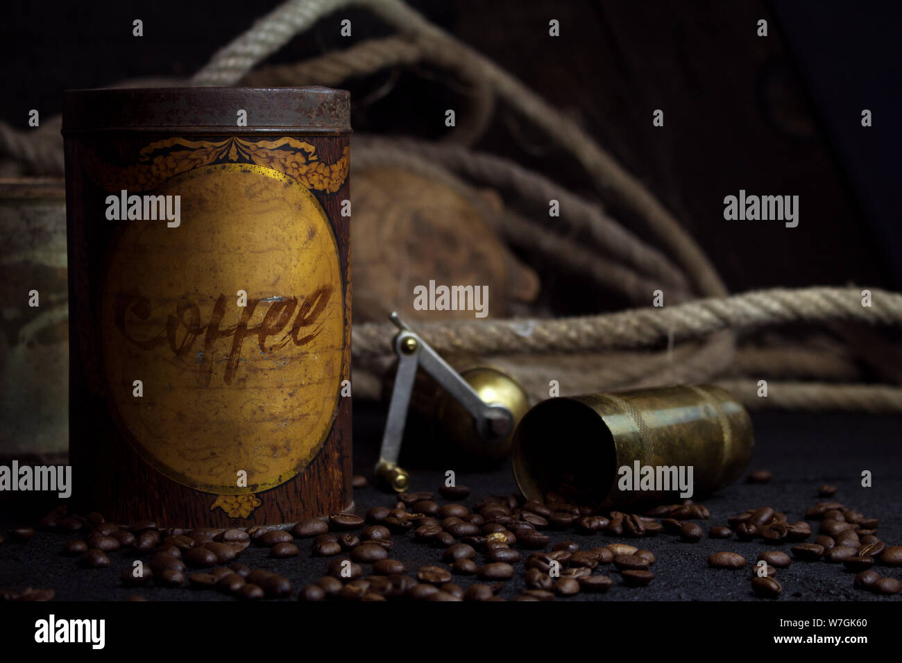 Vintage Rusted Coffee Tin Canister and Grinder With Coffee Beans On a ...