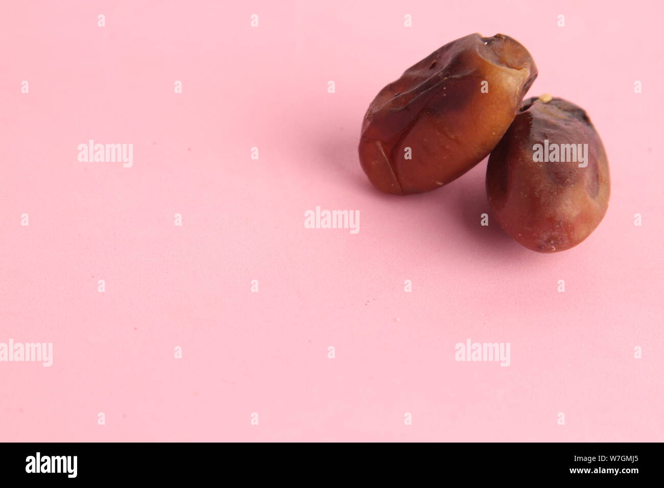 Dry dates on colorful background Stock Photo - Alamy