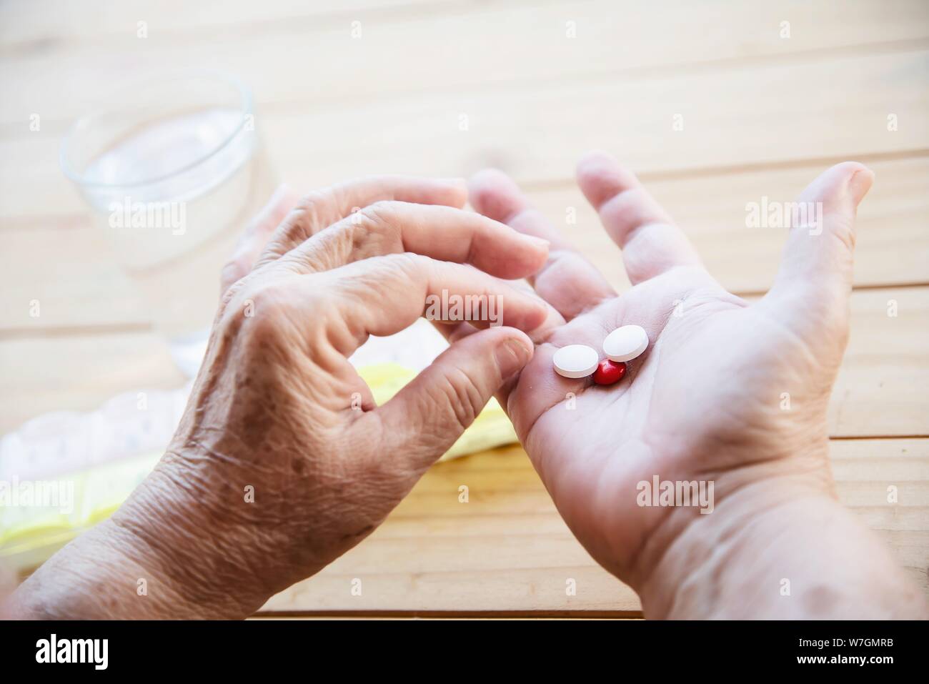 Old lady prepare to eat daily medicine pill - people healthcare with ...