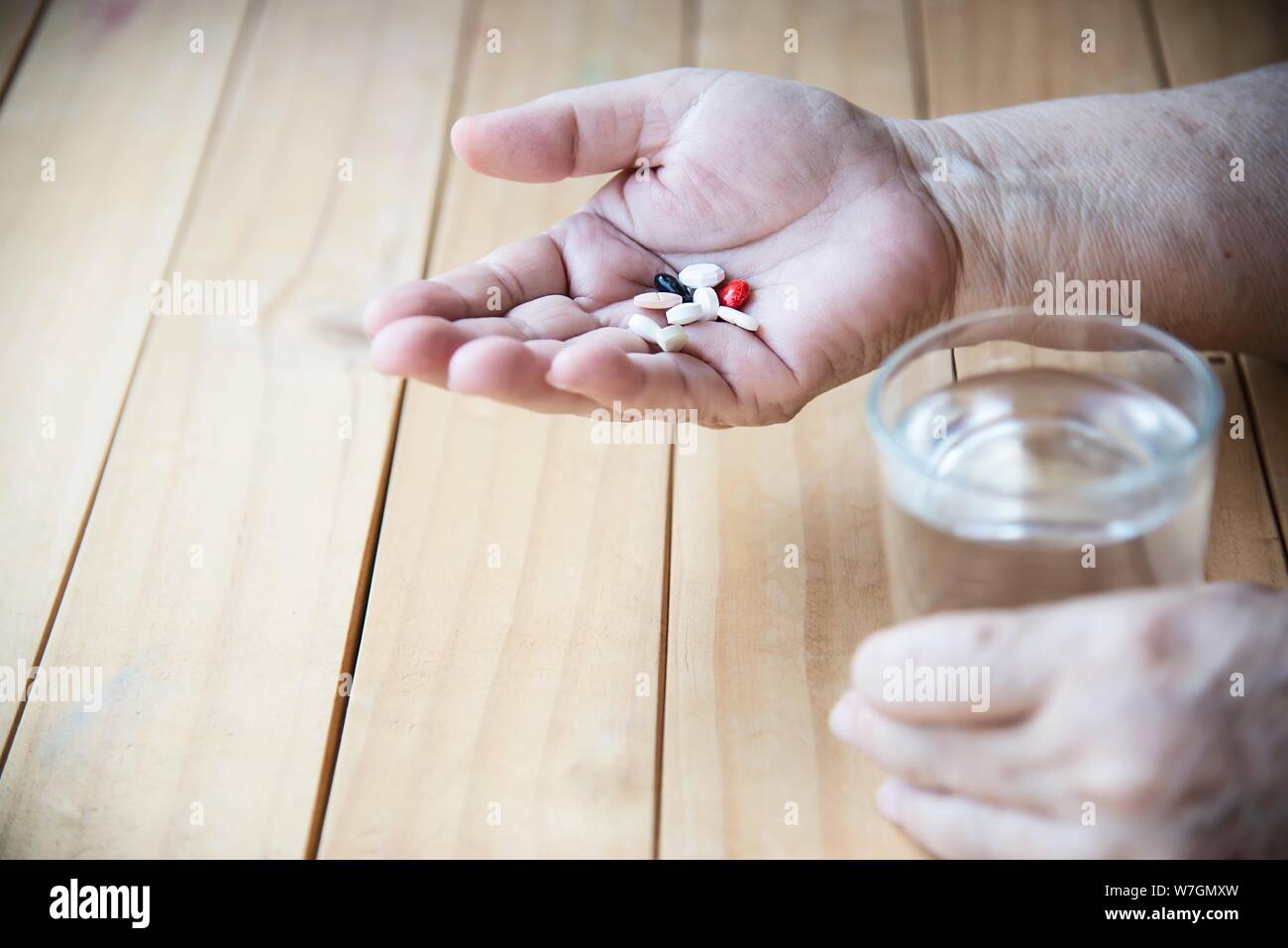 Old lady prepare to eat daily medicine pill - people healthcare with ...
