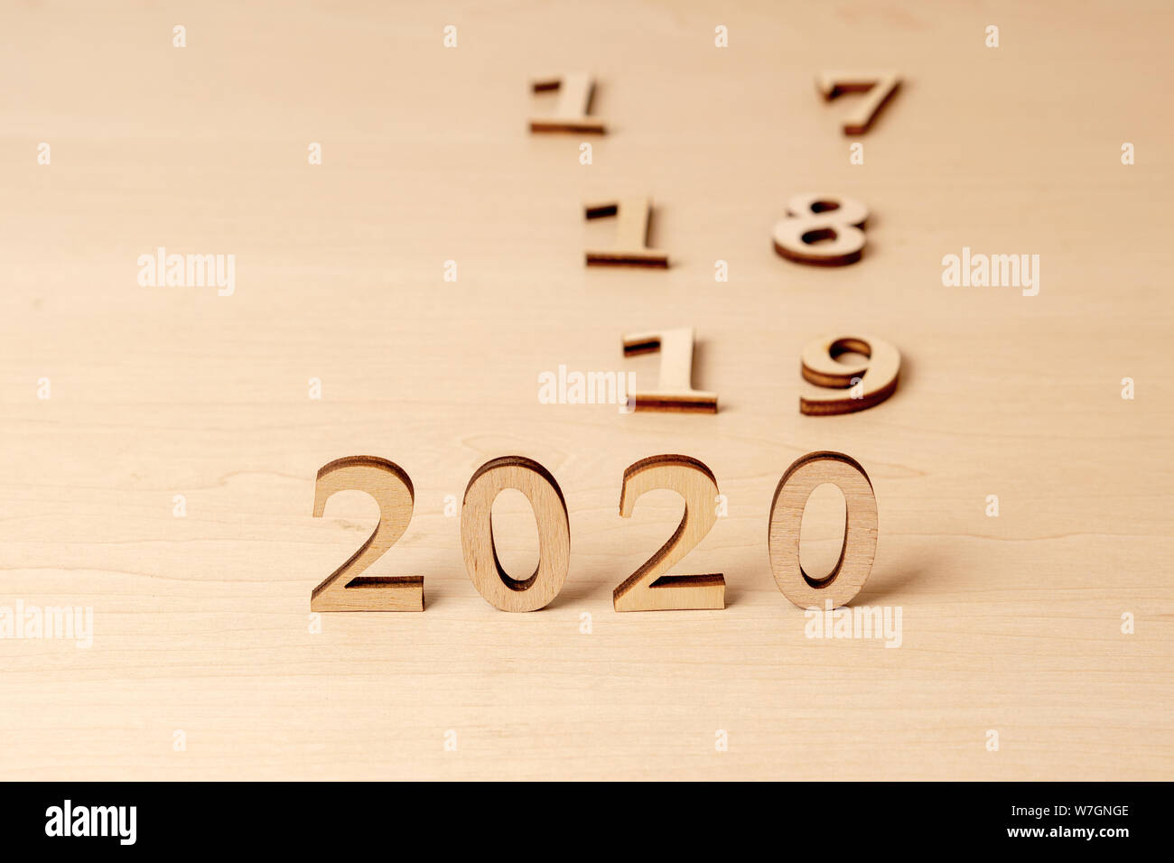 2020 new year change 2019, 2018 and 2017. Wooden numbers on a light ...