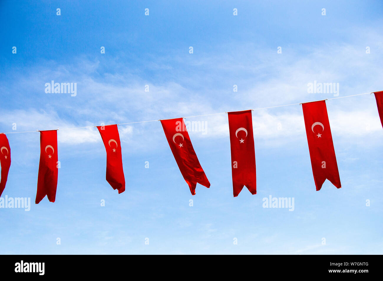 Turkish national flags with white star and moon in sky Stock Photo - Alamy