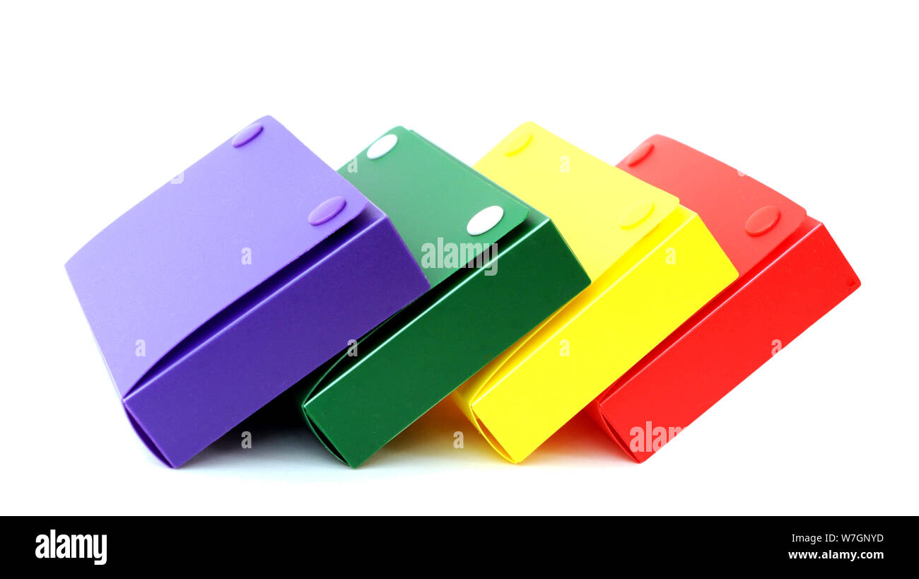 some colorful school boxes on white background Stock Photo - Alamy