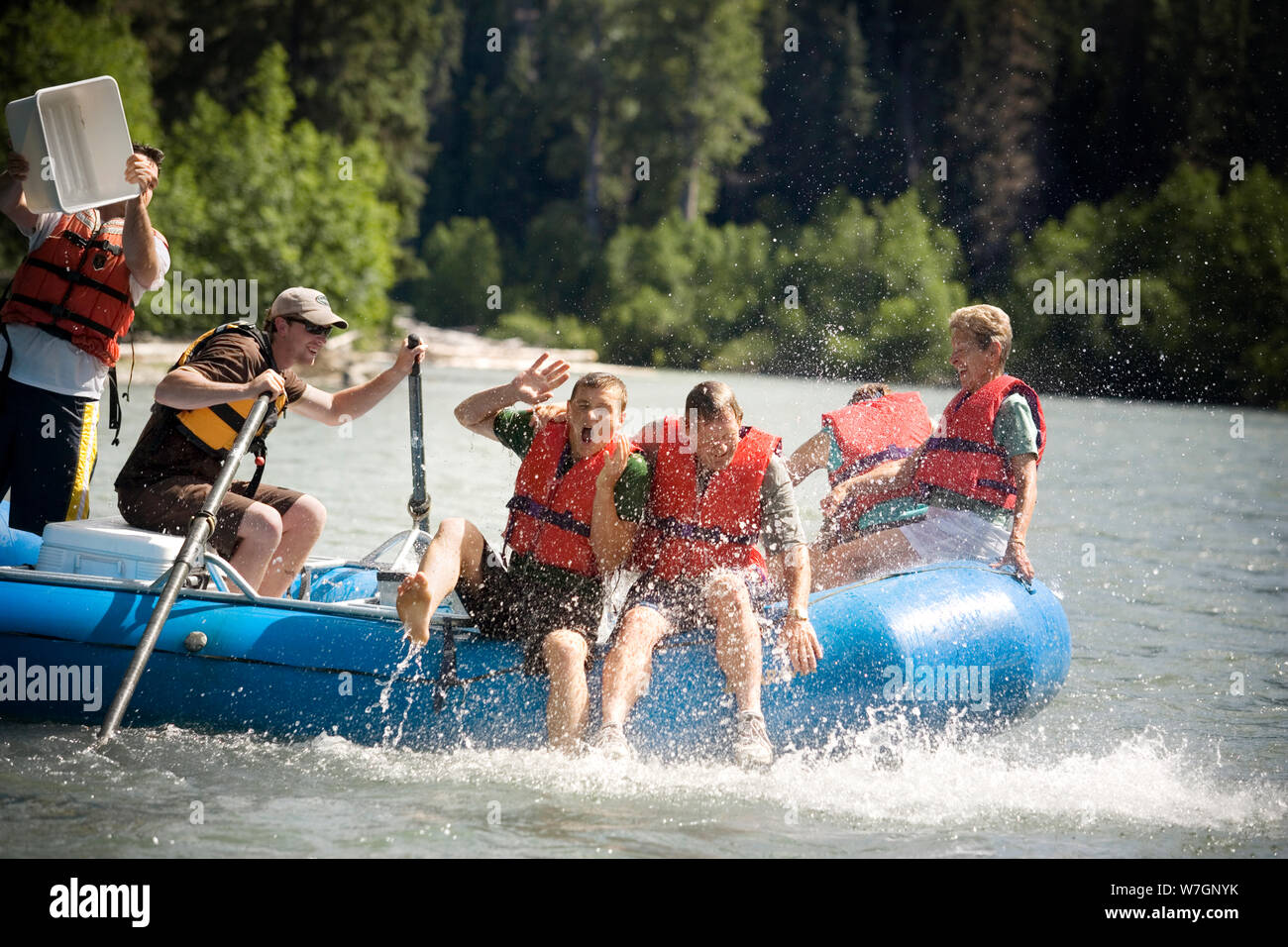 A group of men and boys having fun on an inflatable raft Stock Photo ...