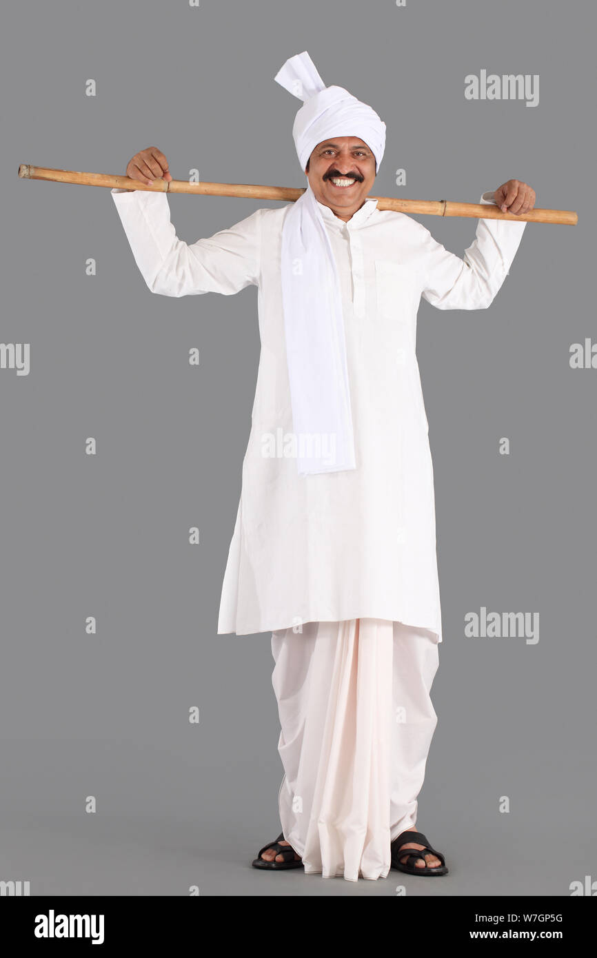 Rural man standing with his cane Stock Photo - Alamy