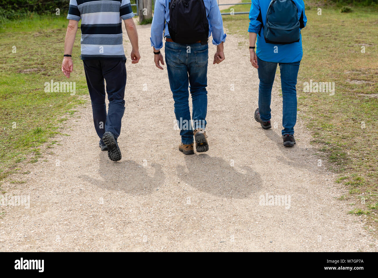Three people walking on a path hi-res stock photography and images - Alamy