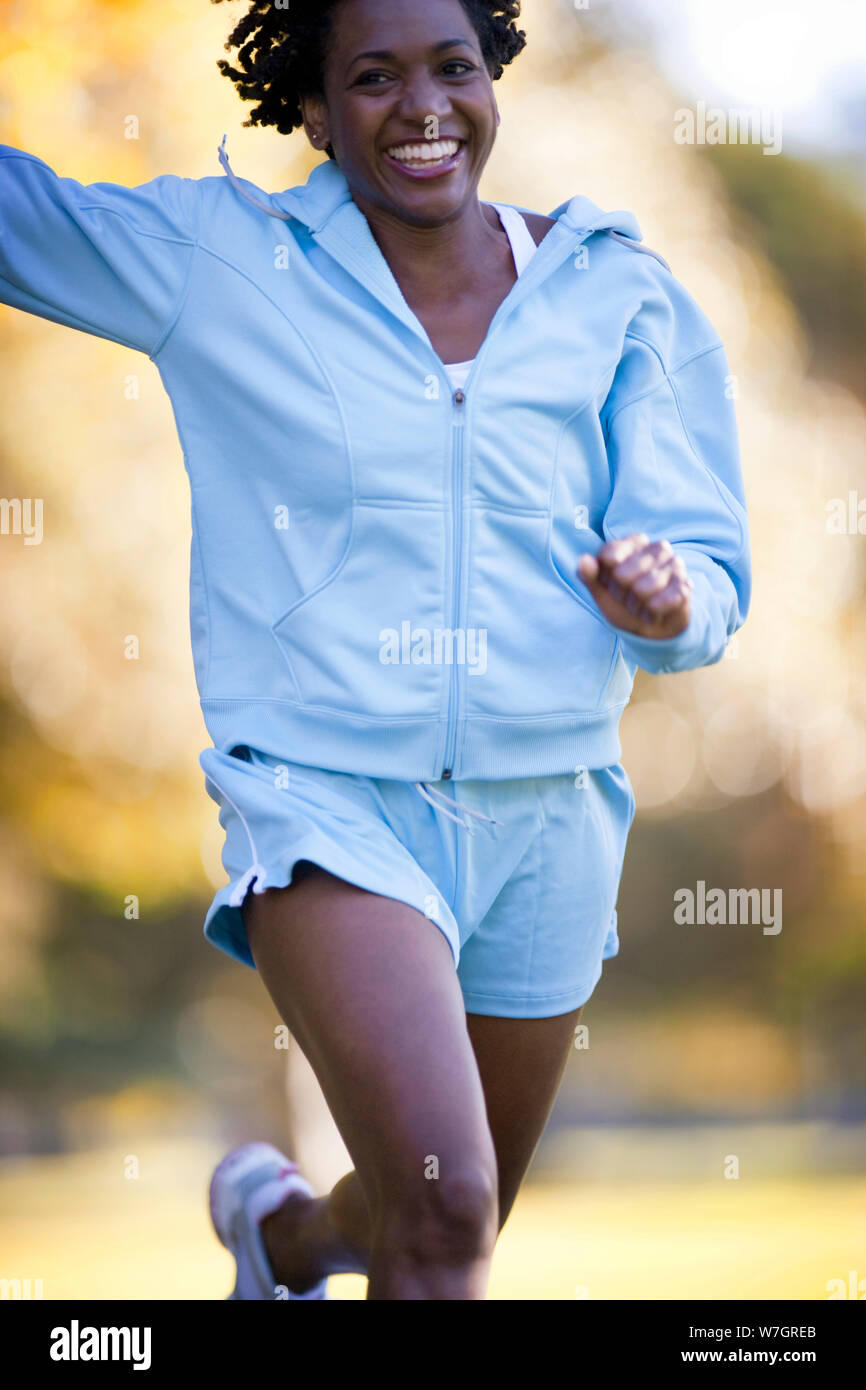 Woman leaping and running Stock Photo - Alamy