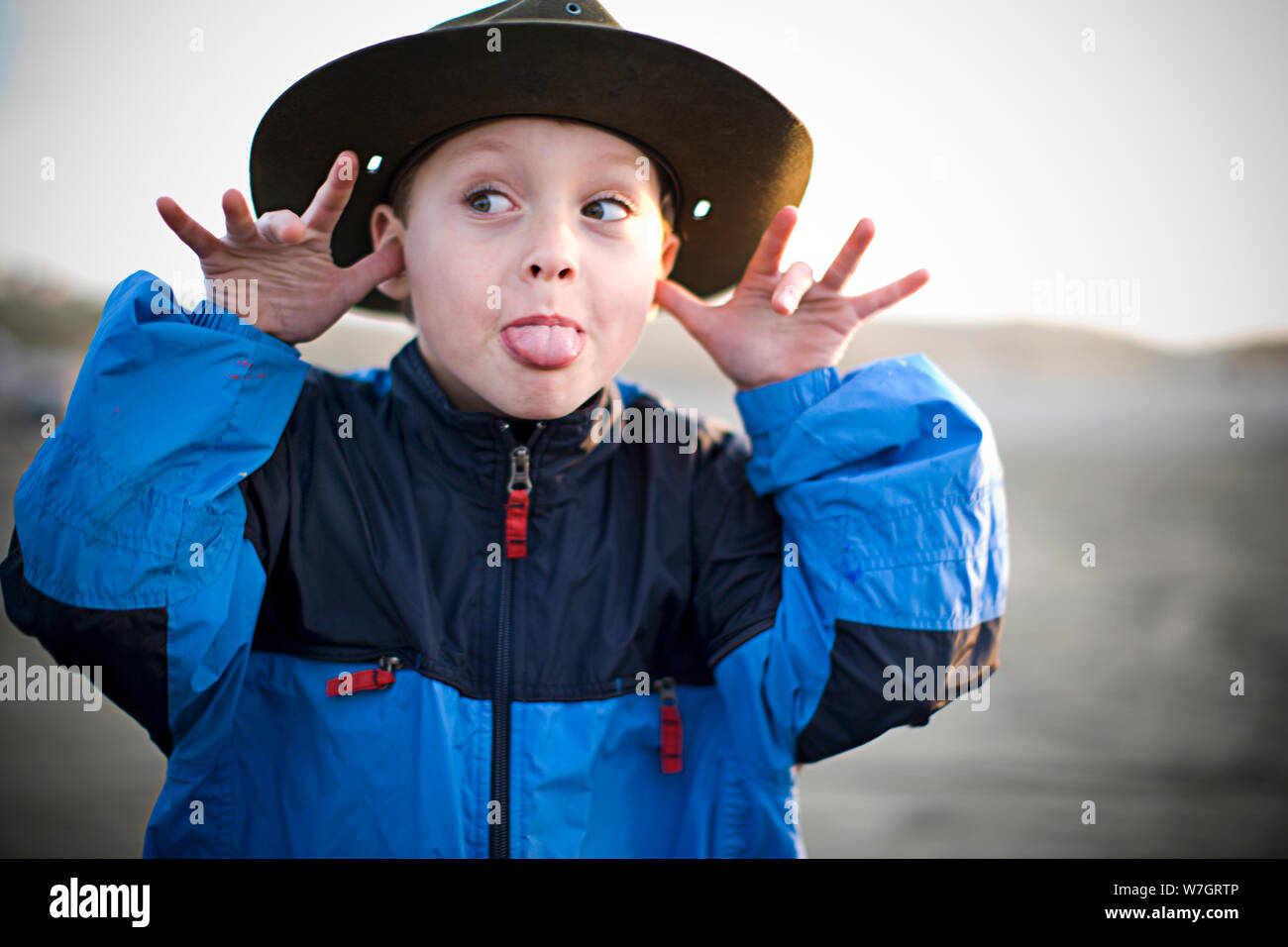 Boy pulling face Stock Photo - Alamy