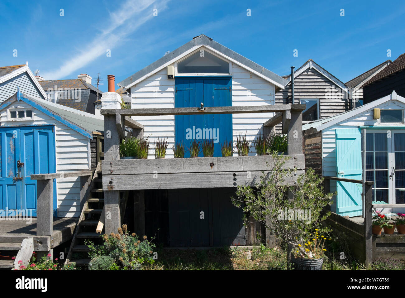 Traditional weatherboard houses and huts along the beach at Whitstable ...
