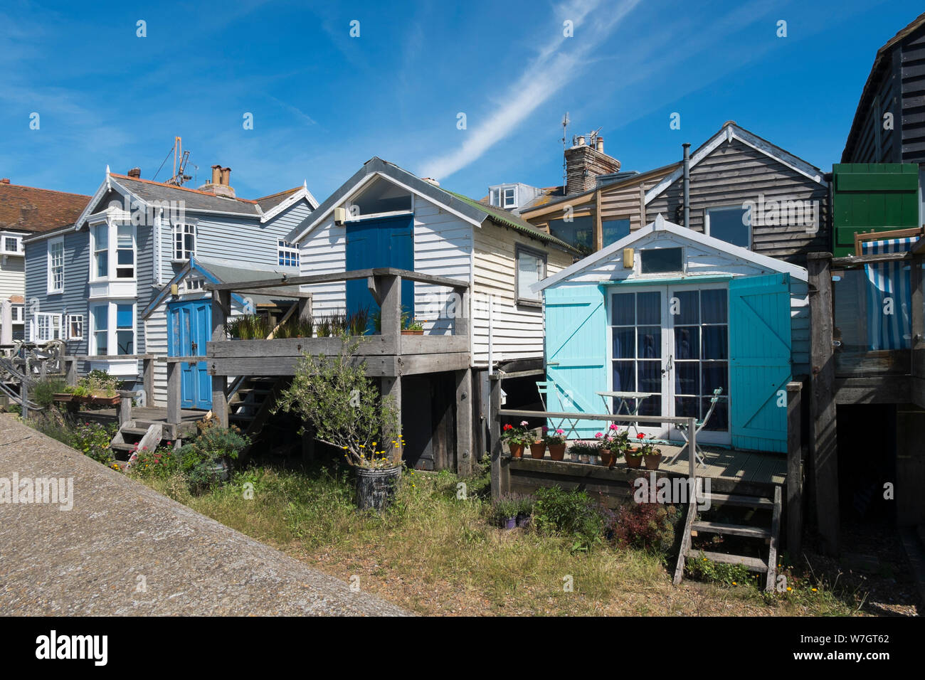 Traditional weatherboard houses and huts along the beach at Whitstable ...