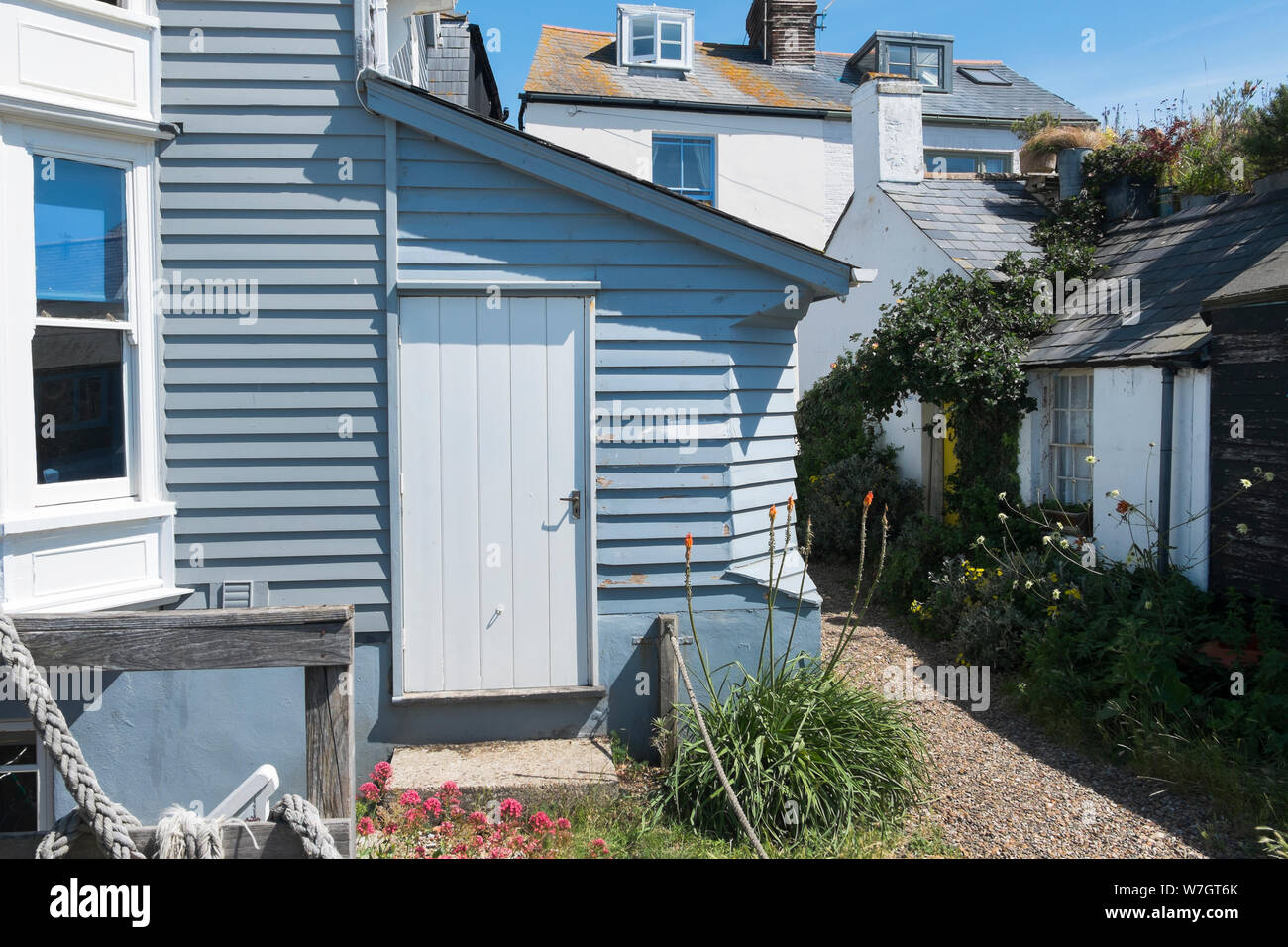 Traditional weatherboard houses and huts along the beach at Whitstable ...