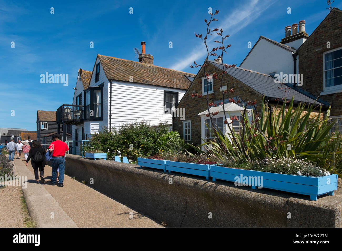 Traditional weatherboard houses and huts along the beach at Whitstable ...