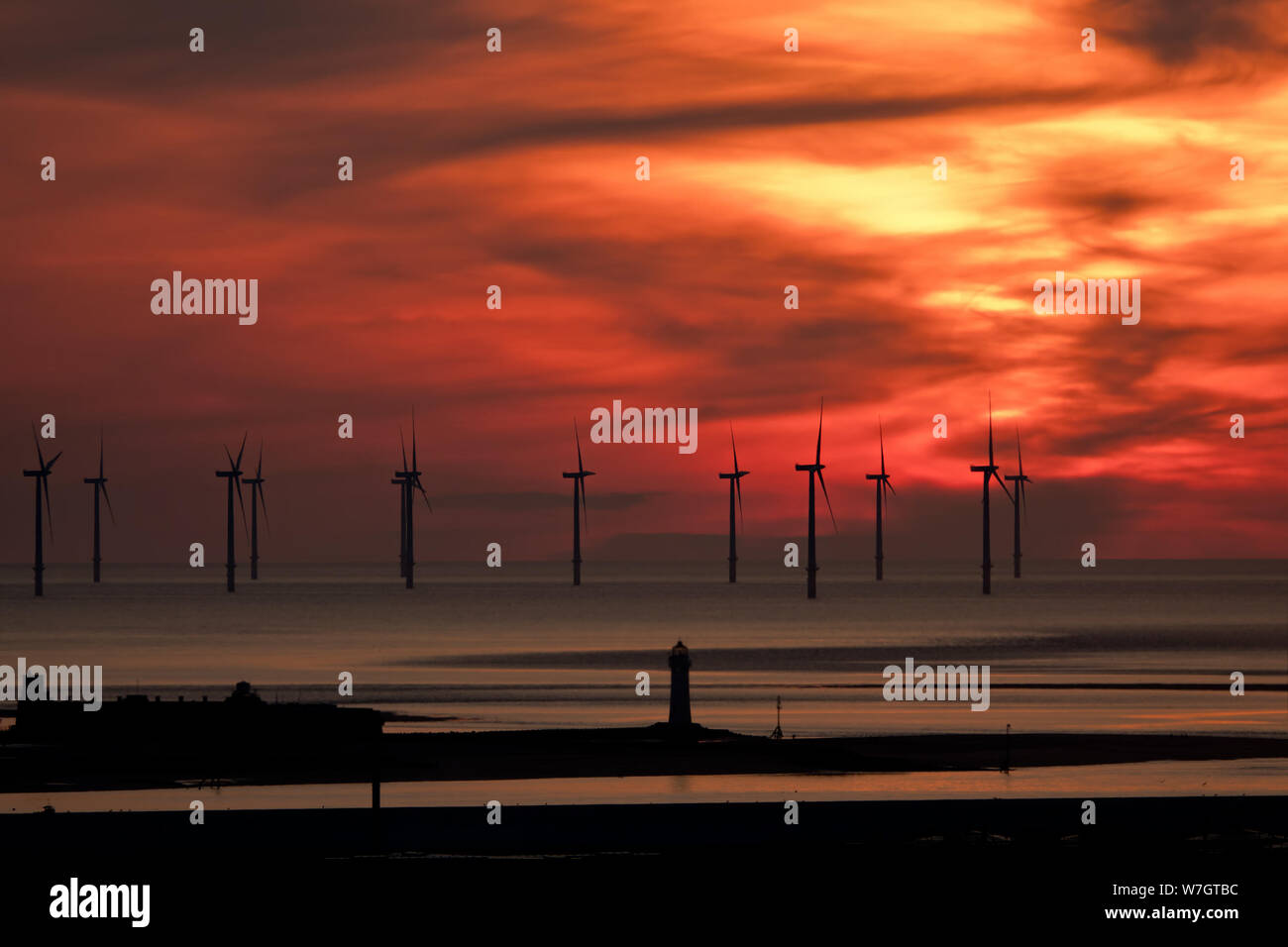 Looking over the River Mersey at sunset towards Burbo Bank Offshore ...
