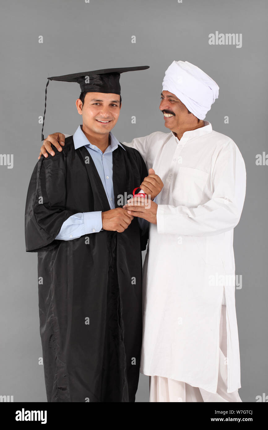 Male graduate with his father Stock Photo - Alamy