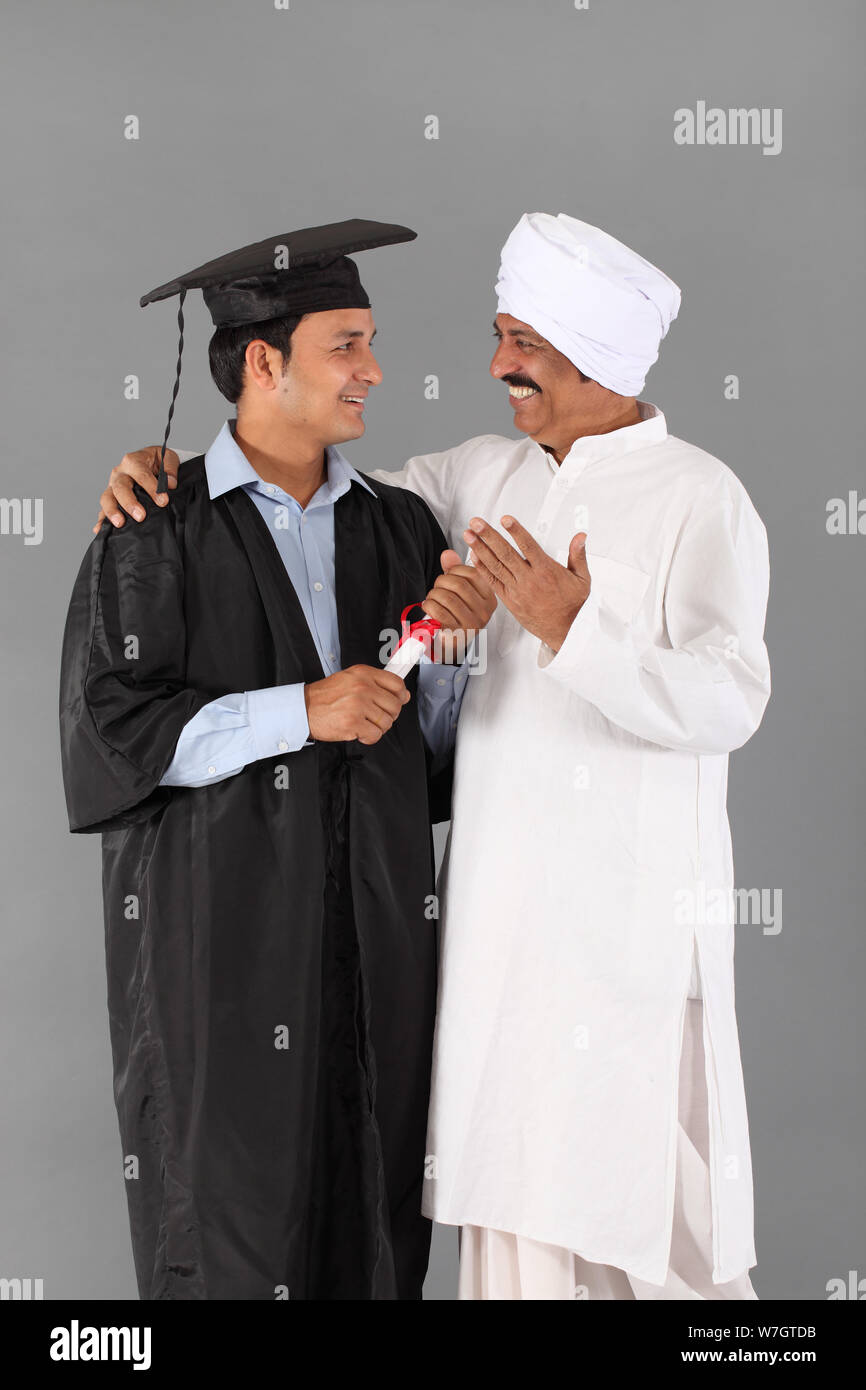 Male graduate with his father Stock Photo - Alamy
