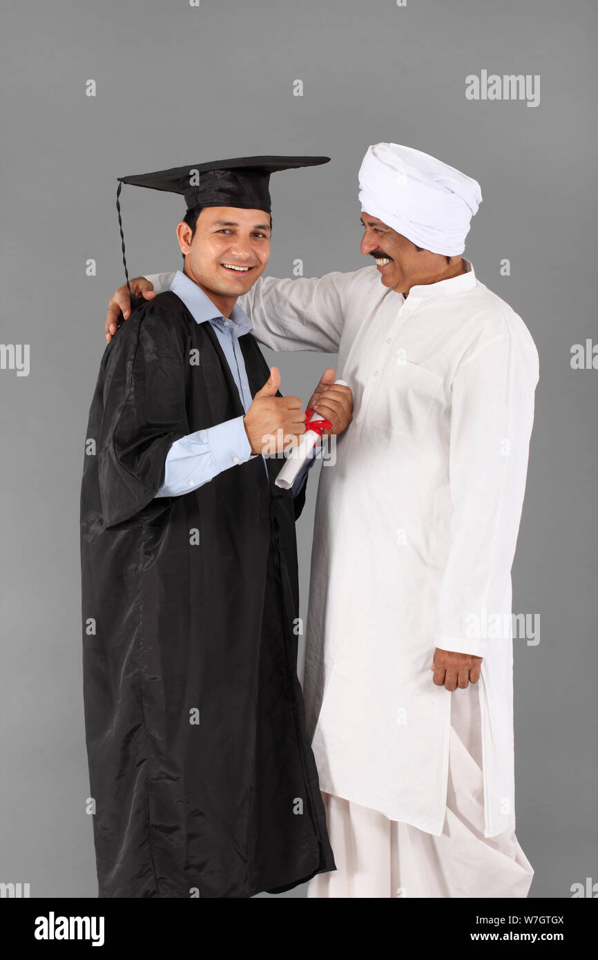 Male graduate with his father Stock Photo - Alamy