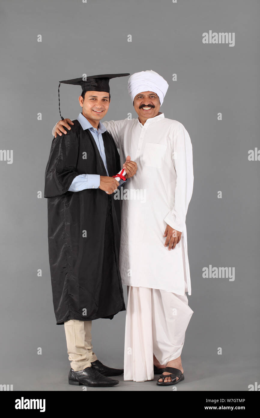 Male graduate with his father Stock Photo - Alamy