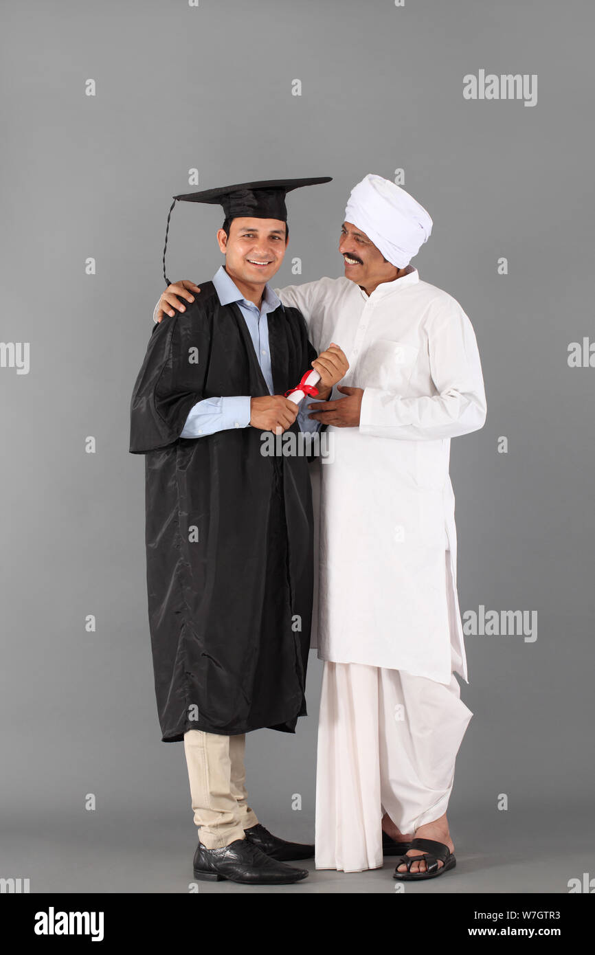 Male graduate with his father Stock Photo - Alamy