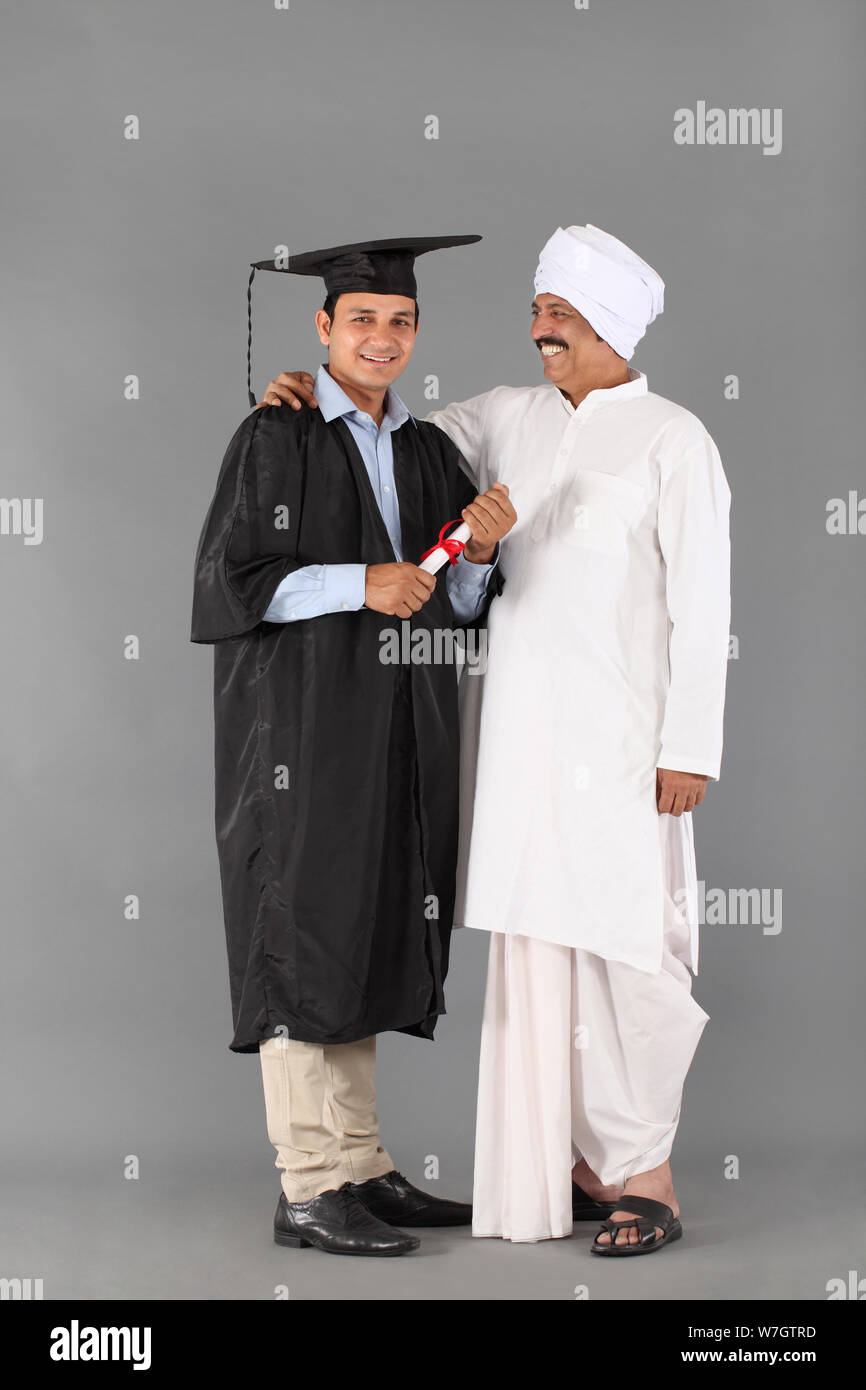Male graduate with his father Stock Photo - Alamy