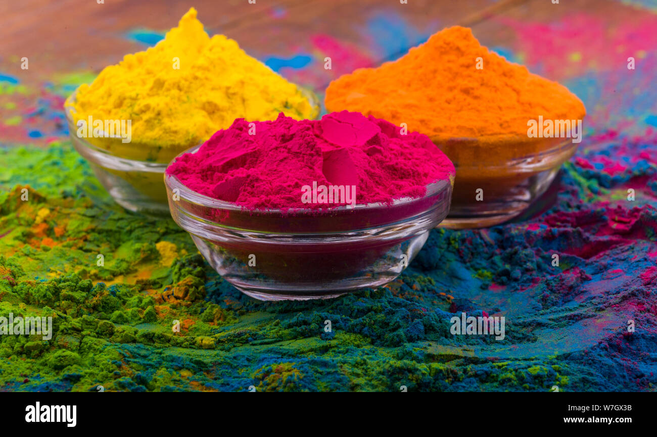 Holi color powder. Organic Gulal colours in bowl for Holi festival ...
