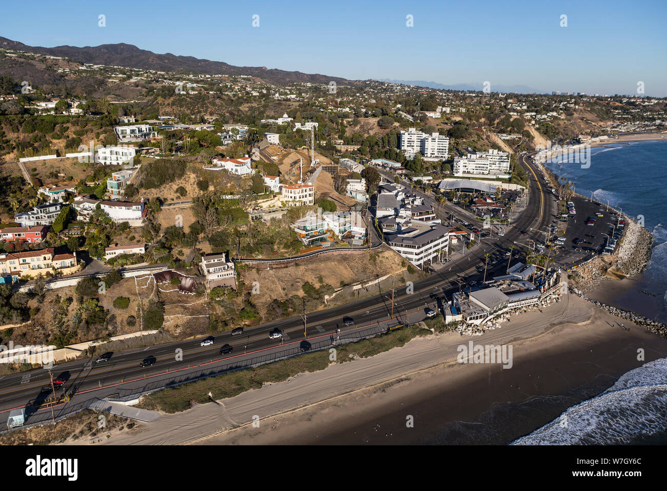 Aerial of Pacific Palisades homes and buildings along Pacific Coast ...