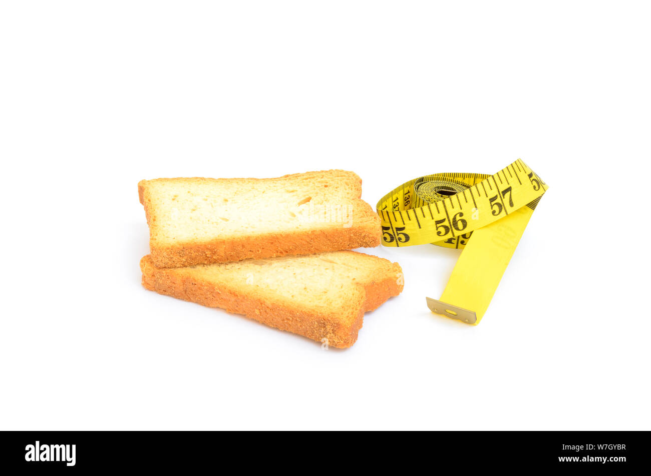 Closeup of measuring tape and dry rusk Stock Photo - Alamy