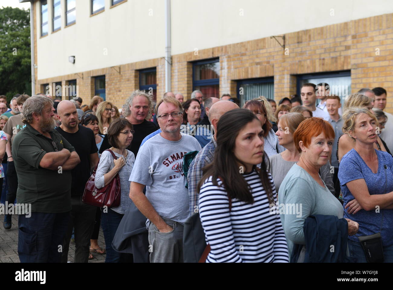 Residents from Whaley Bridge queuing at a school in Chapel-en-le-Frith ...
