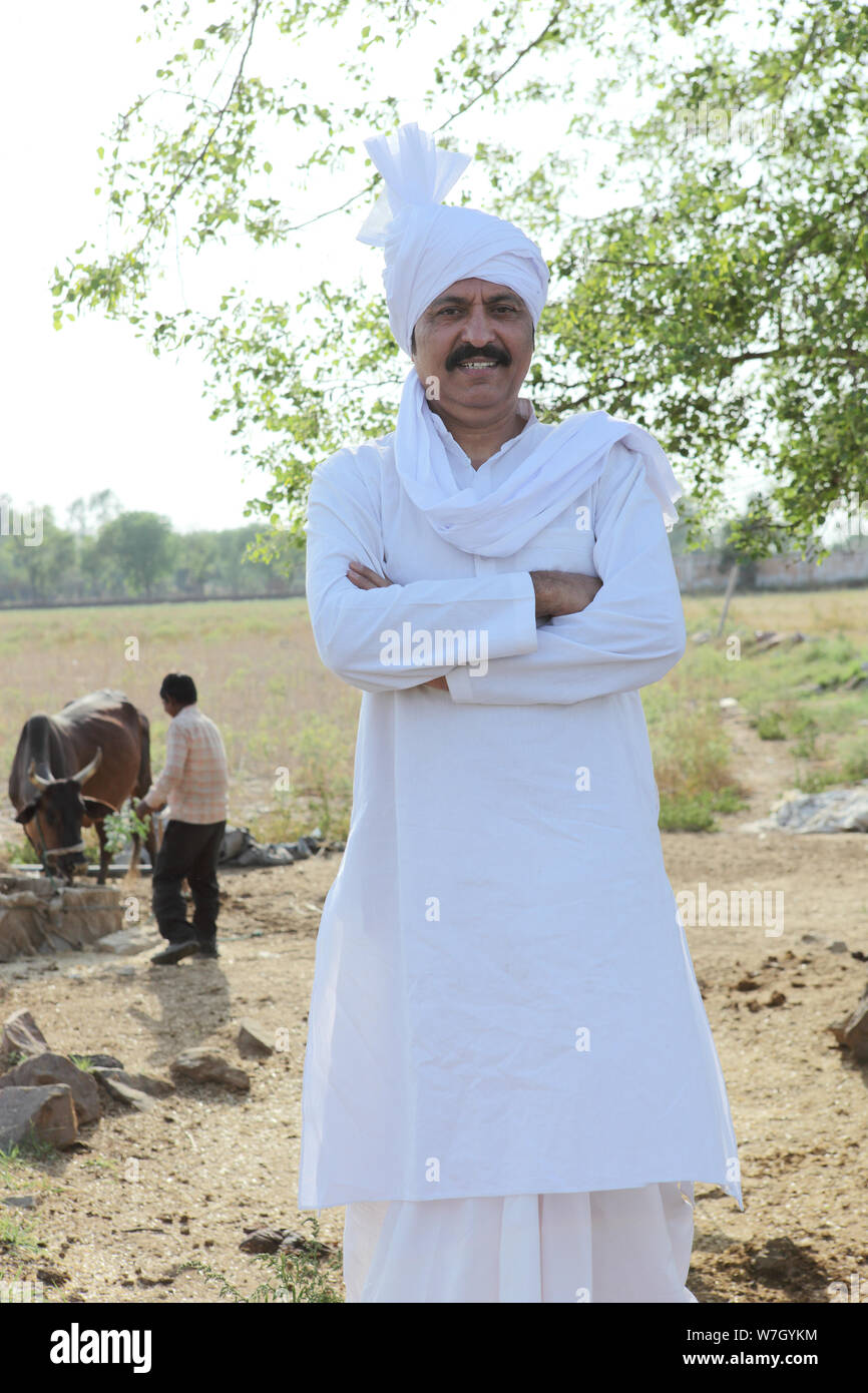Rural Man standing with his arms crossed Stock Photo - Alamy