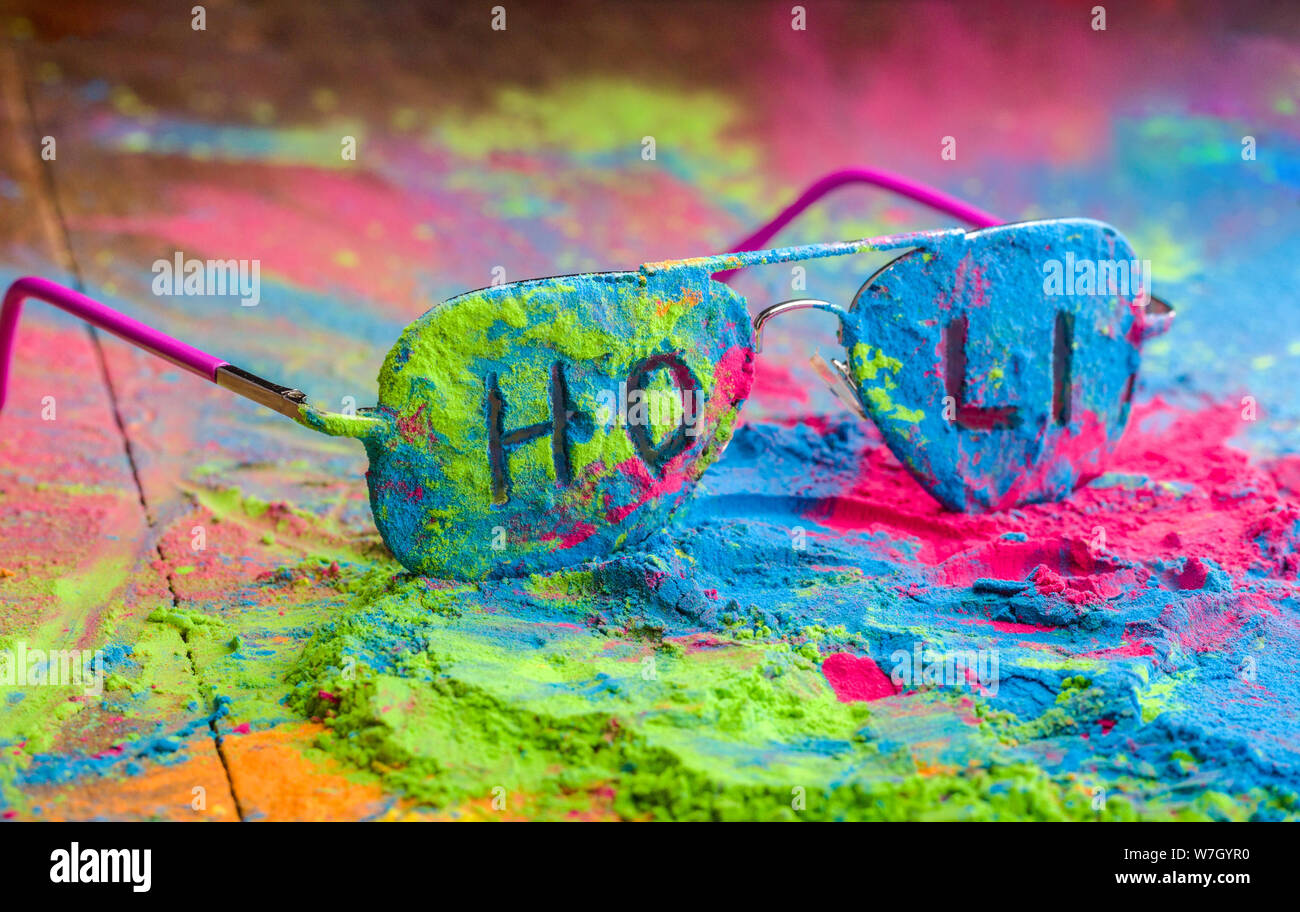 Holi color powder on sunglasses. Organic Gulal colours on eyeglasses ...