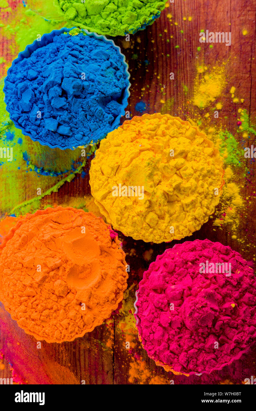 top view of colorful traditional holi powder in bowls on wood Stock ...