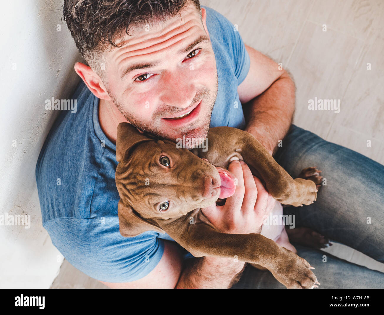 Man Hug Puppy High Resolution Stock Photography and Images - Alamy