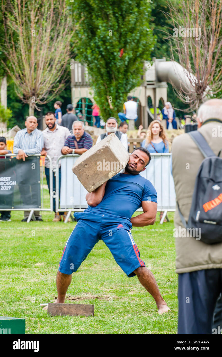 Asian games stone weightlifting Stock Photo - Alamy