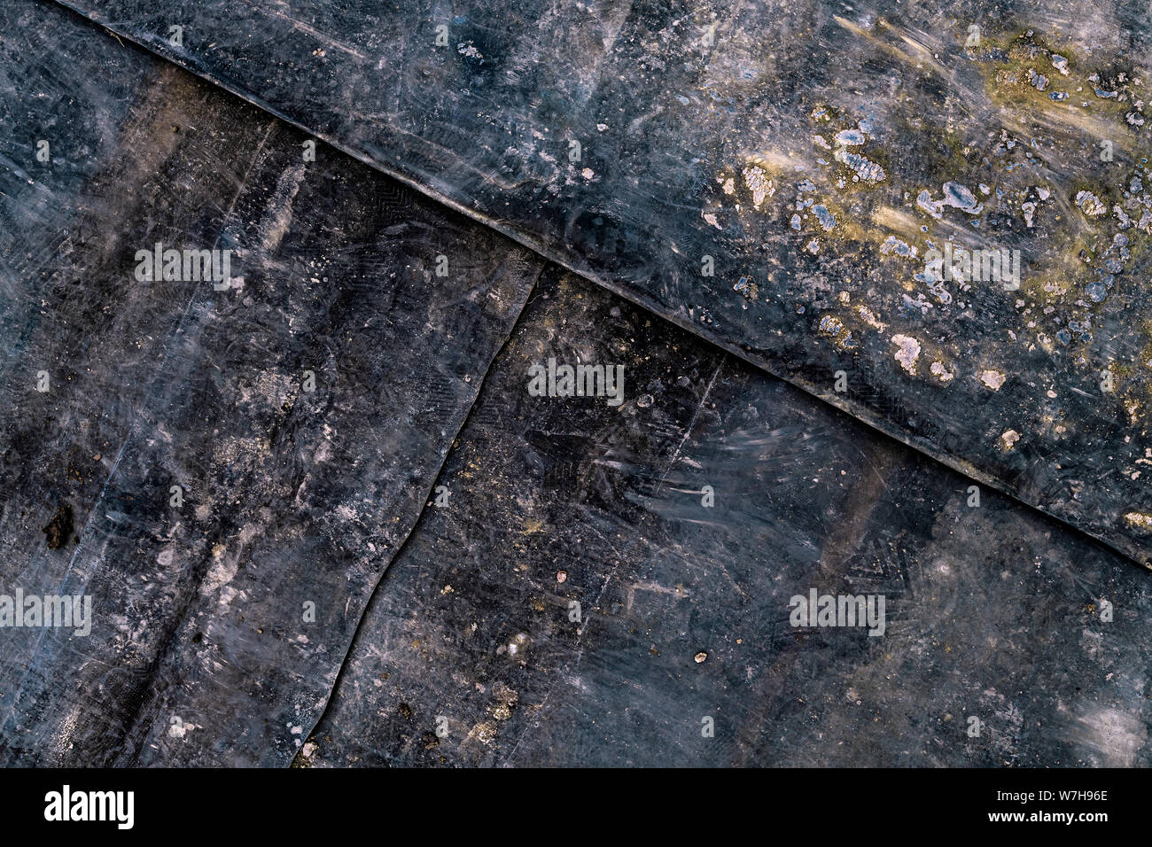 Dark grunge background with footprints and dirt particles, top view ...