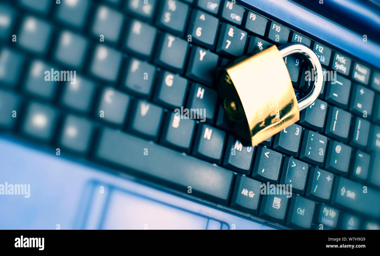 Laptop keyboard with locker and keys on top Stock Photo - Alamy