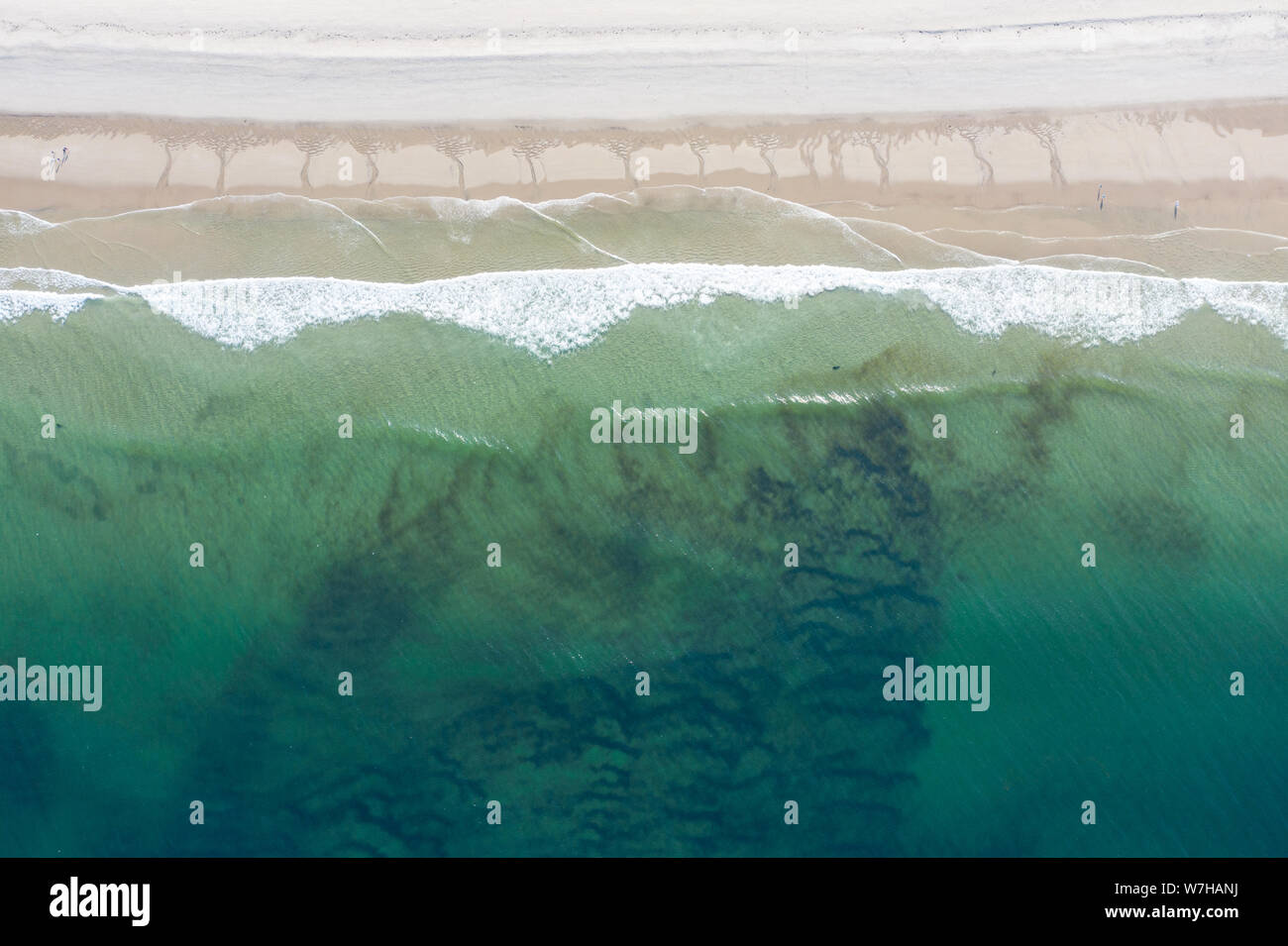 The waters of the Atlantic Ocean bathe a scenic beach on Cape Cod ...