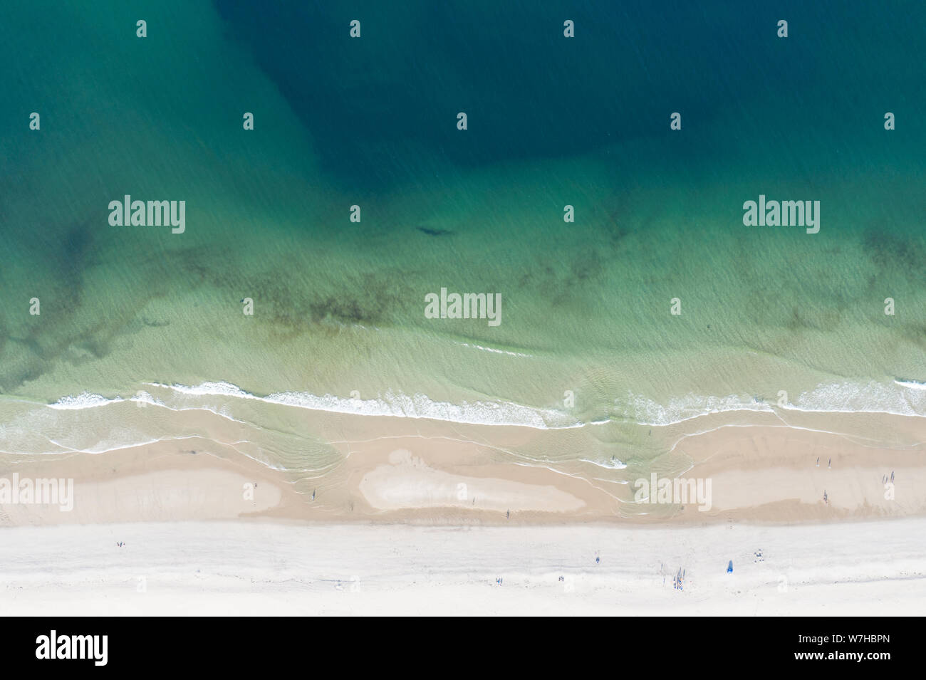 The waters of the Atlantic Ocean bathe a scenic beach on Cape Cod ...