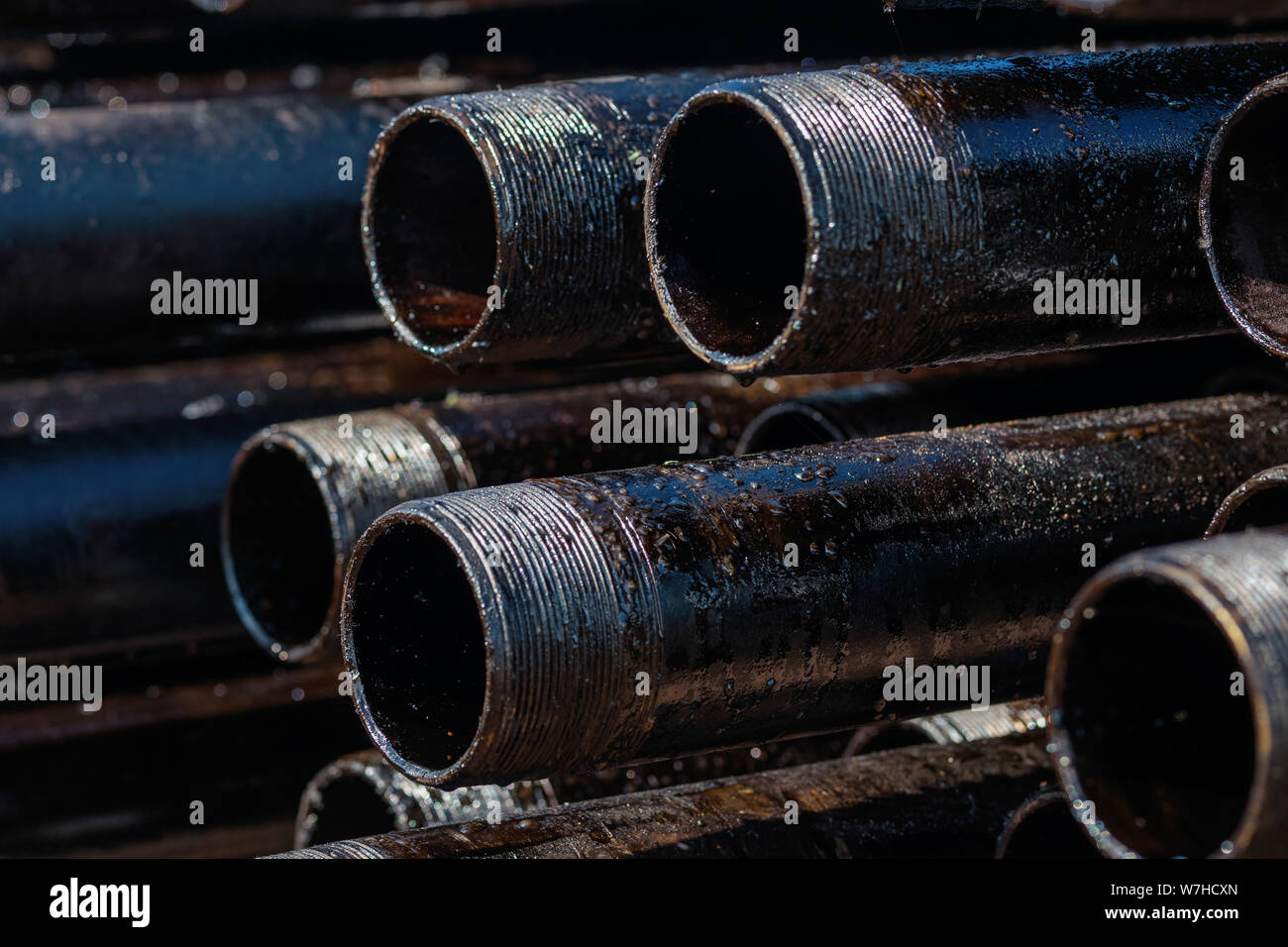 Close up drill pipe thread with pipe dope grease lay down on rig floor ...