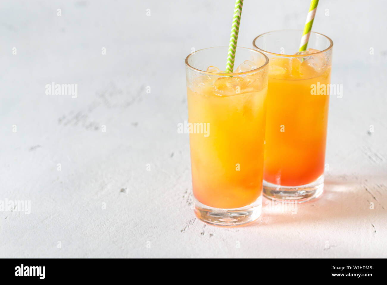 Two glasses of tequila sunrise cocktail Stock Photo - Alamy