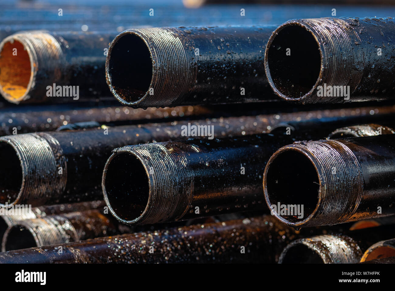 Close up drill pipe thread with pipe dope grease lay down on rig floor ...
