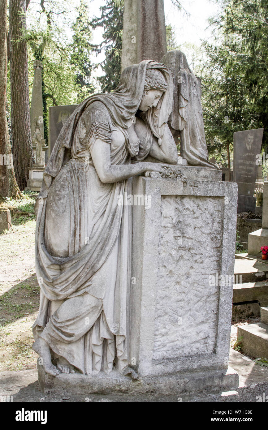 Lviv, Ukraine - April 26, 2019: Statues and tombstones at the Lychakiv ...
