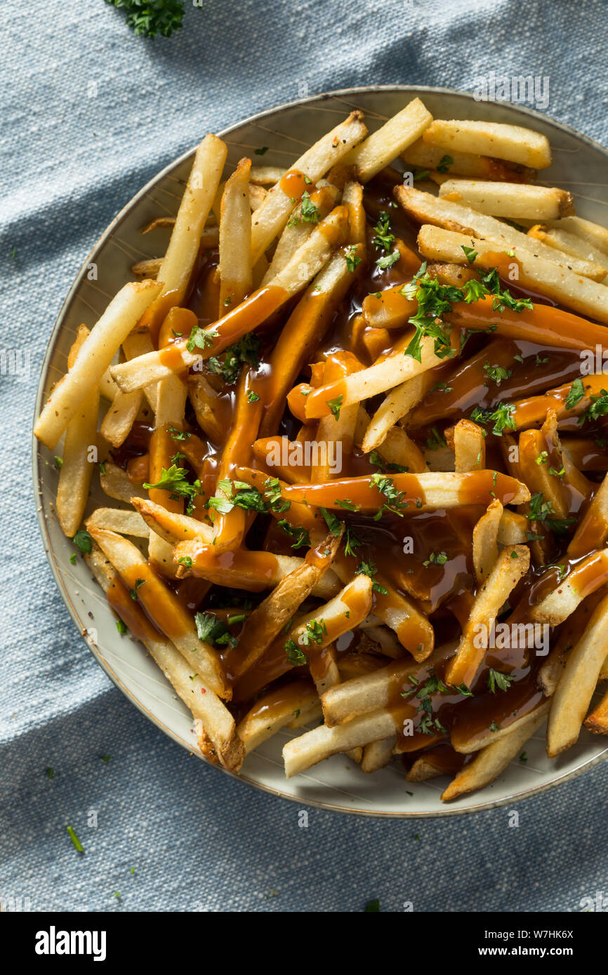 Homemade American Gravy Fries with Salt and Pepper Stock Photo - Alamy
