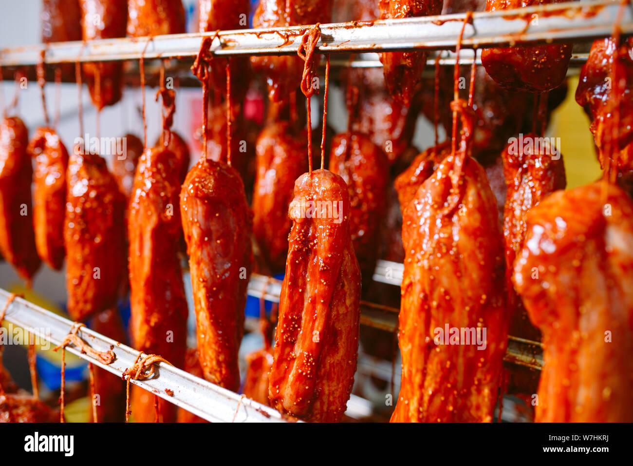 Smoked ham in the oven. Sausage production in the factory Stock Photo ...