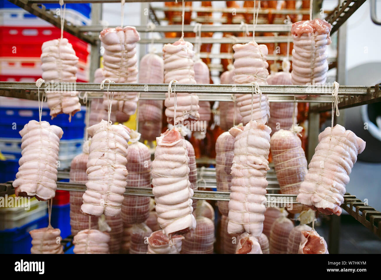 Smoked ham in the oven. Sausage production in the factory Stock Photo ...