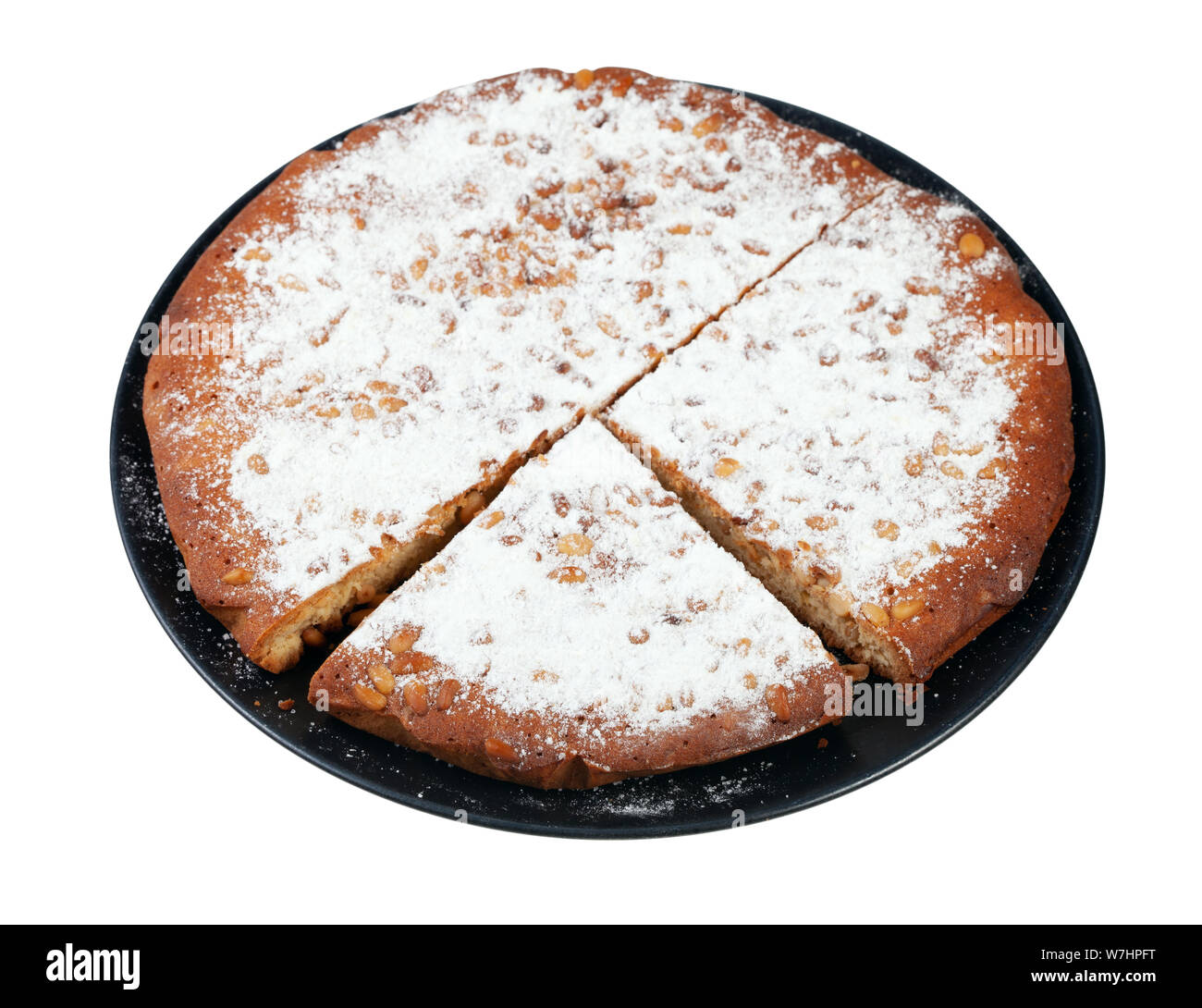 Italian Pine Nut Cake on black plate cut out on white background Stock ...