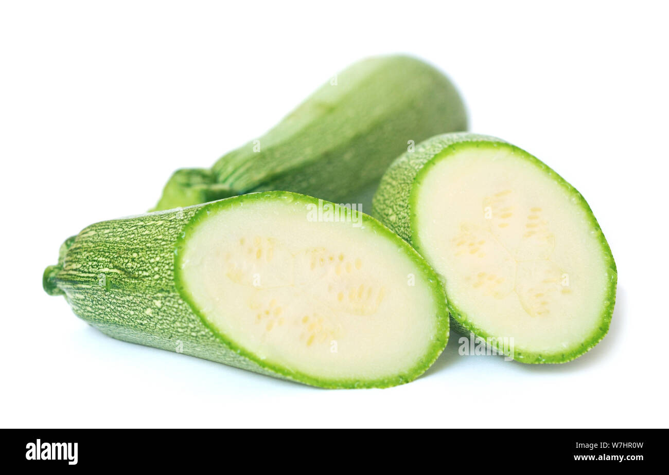 chopped and whole marrow zucchini on white background Stock Photo - Alamy